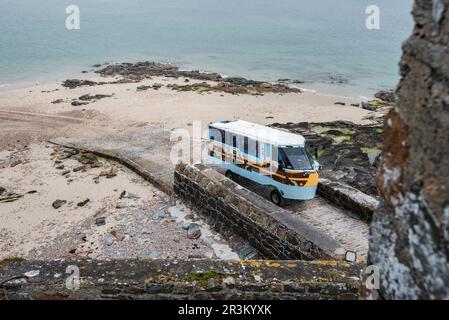 The amphibious duck ferry vehicle negotiates the tidal waters towards ...