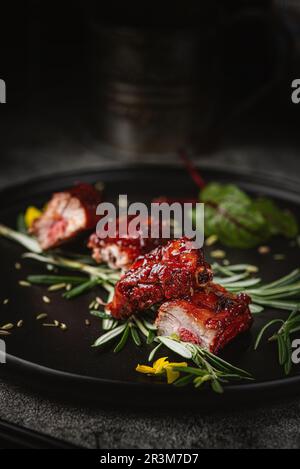 Grilled pork ribs with sweet and sour caramelized grilled sauce, smoke ...