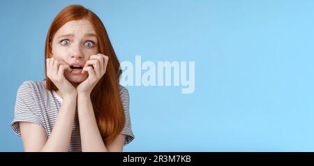 Scared speechless stunned frightened redhead girl trembling fear wide ...