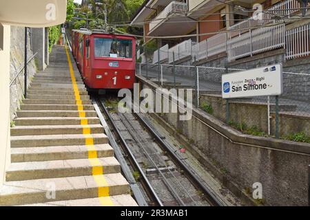Train arriving at San Simone station on the Zecca-Righi funicular cable ...