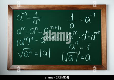 Many different math formulas on white background, illustration. Algebra ...