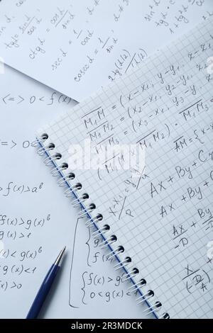 Notebook with different mathematical formulas and pen, top view Stock ...