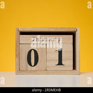 calendar date text on wooden frame with blurred background of ocean ...