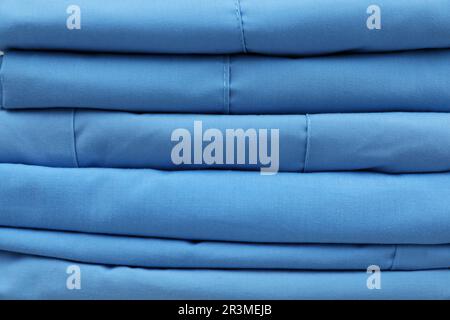 Light blue medical uniforms as background, closeup Stock Photo - Alamy