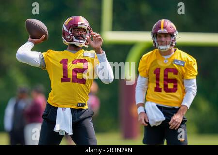 Washington Commanders quarterback Jacoby Brissett stretches during the ...