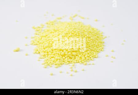 Granulated Sulfur or sulphur on white background Stock Photo - Alamy