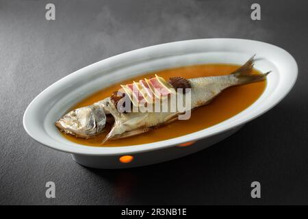 Steamed Topmouth culter fish with ham，Steamed white fish Stock Photo ...