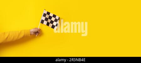 Checkered flag in hand panoramic layout Stock Photo - Alamy