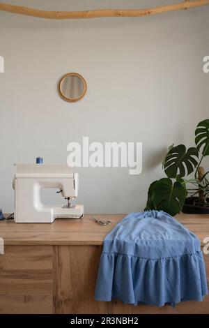 Sewing machine with light blue fabric, closeup. Space for text Stock ...