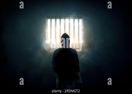 Hacker in prison cell Stock Photo - Alamy