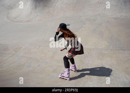 aggressive roller skater riding in skatepark Stock Photo - Alamy