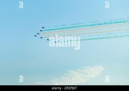 Fighter jets squadron with traces in Saudi Arabian national flag colors ...