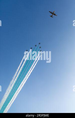 Fighter jets squadron with traces in Saudi Arabian national flag colors ...