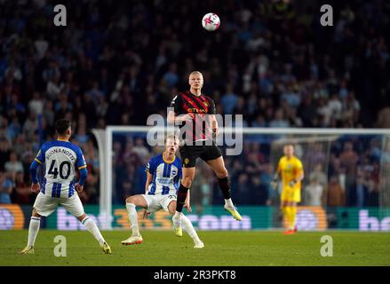 Erling Haaland of Manchester City wins a header against Nick Woltemade ...