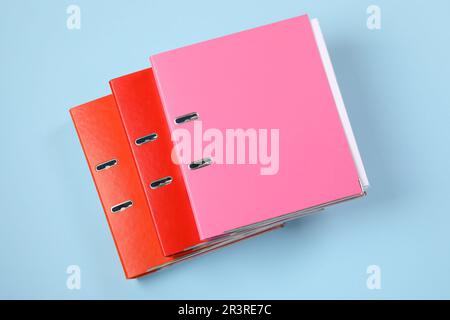 Many office folders on light blue background, flat lay Stock Photo - Alamy