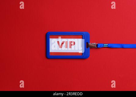 Plastic vip badge on red background, top view Stock Photo - Alamy