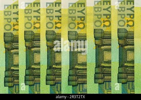 Green banknotes of 100 euros laid out vertically.European Union banking ...