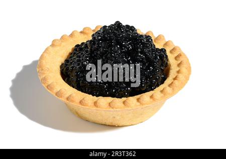 Black caviar in a round tartlet on a white isolated background Stock ...