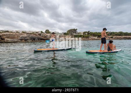 Paddle surfing in the Caló de Sant Antoni, S Arenal de Llucmajor ...