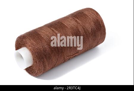 Spool of brown sewing thread isolated on white Stock Photo - Alamy