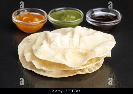 Papadam with various Indian sauces Stock Photo - Alamy