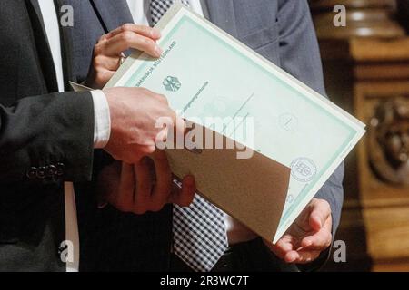 Hamburg, Germany. 23rd May, 2023. A naturalization certificate lies on ...