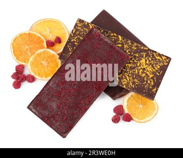 Chocolate bar with freeze dried oranges and berries as background ...