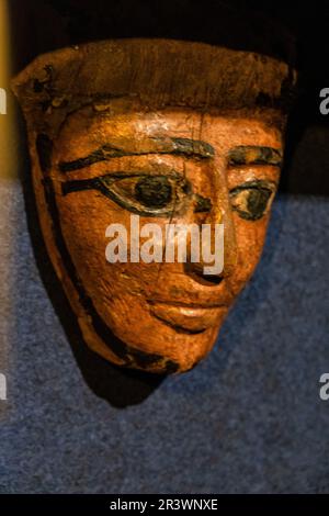 Egyptian anthropomorphic coffin face Stock Photo - Alamy