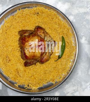 Kabsa dish (Arabic famous traditional food. Mandi rice with grilled ...