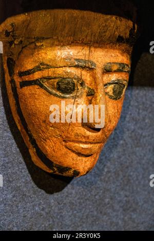 Egyptian anthropomorphic coffin face Stock Photo - Alamy
