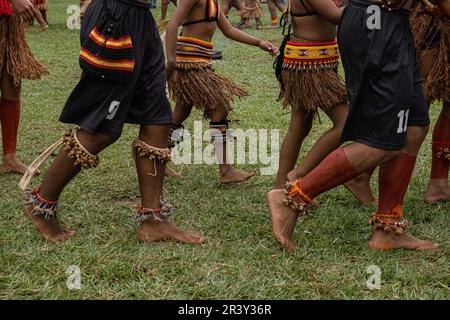 Details of legs and feet of a group of indigenous people wearing ...