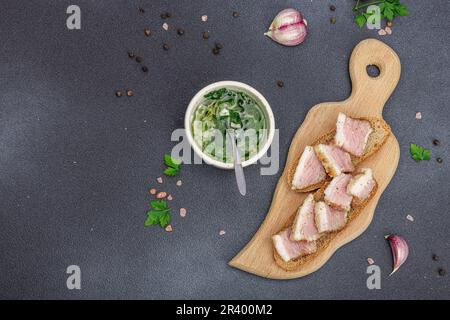 Canapes with rye bread and pieces of salty high-fat meat cooked with ...