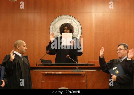 Christopher C. Hite (left) and Hon. Samuel Feng (right) are sworn in by ...
