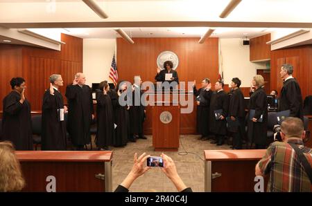 Christopher C. Hite (left) and Hon. Samuel Feng (right) are sworn in by ...