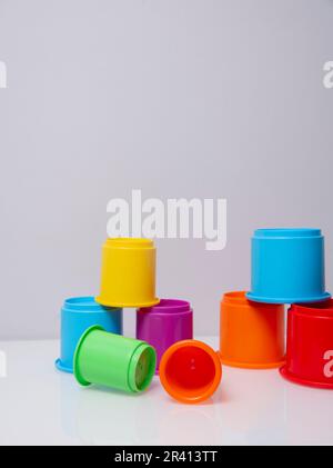 Colorful stacking plastic cups on white background.balance concept Stock Photo - Alamy