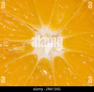 Fresh juicy orange cut piece. Isolated on white background Stock Photo ...
