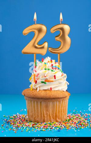 Candle number 23 - Cake birthday in orange background Stock Photo - Alamy
