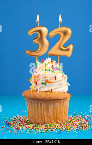 Candle number 32 - Cake birthday in coral fusion background Stock Photo ...
