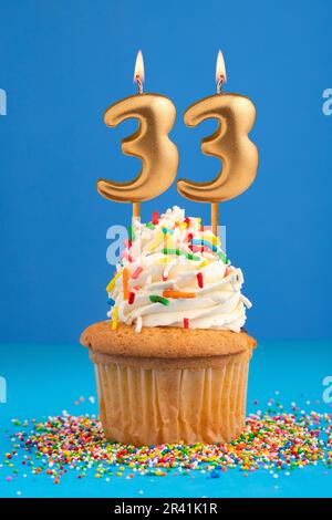 birthday cake with number 33 - cupcake on orange background with ...