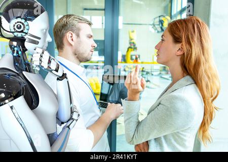 Industrial Robotic Engineer And Humanoid Robot Stock Photo - Alamy