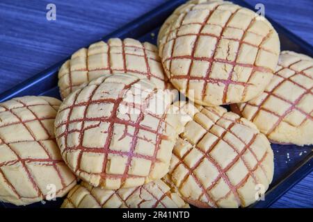 Mexican sweet bread conchas with melon bread scoring on vanilla ...