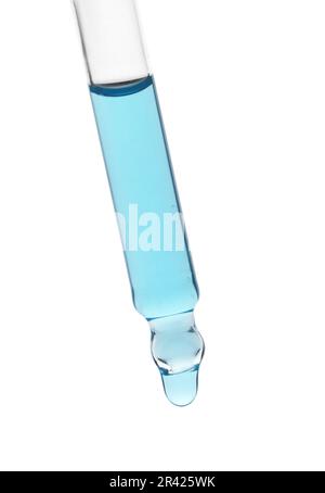 Dripping light blue facial serum from pipette on white background ...
