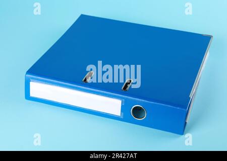 Hardcover folder on blue background Stock Photo - Alamy