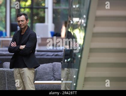 Lululemon CEO Calvin McDonald poses after speaking at a news conference ...