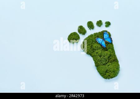 ecological footprint concept, barefoot footprint made of lush green ...