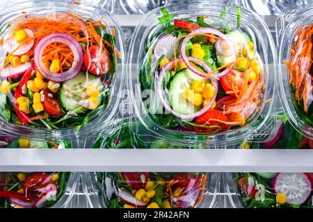 Plastic boxes with pre-packaged vegetable salads Stock Photo - Alamy