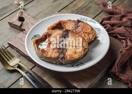 Ikan Tongkol goreng or fried Mackerel Tuna fish. Fried dry with ...