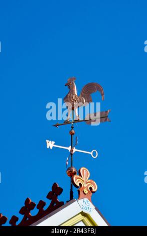 Sheet copper weathercock on house roof Stock Photo - Alamy