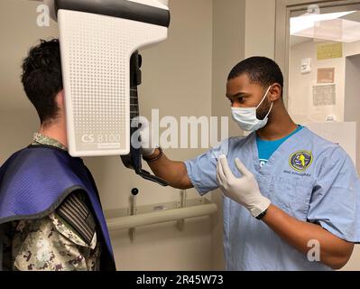 An X-ray technician performs an X-ray on a patient at Gorgas Army ...