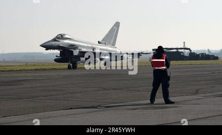 A Team Mildenhall member from transient alert prepares to marshal out ...